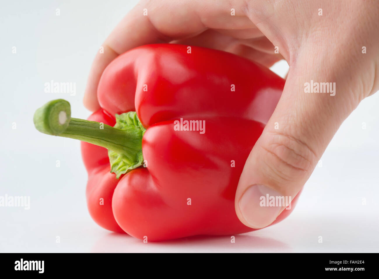 Closeup hand putting ripe red hi-res stock photography and images - Alamy