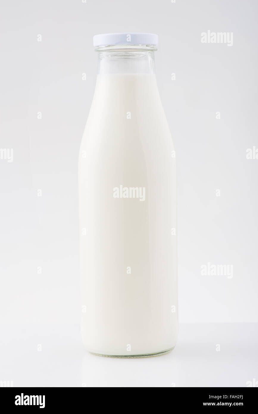 Medium bottle of milk is on the surface Stock Photo - Alamy