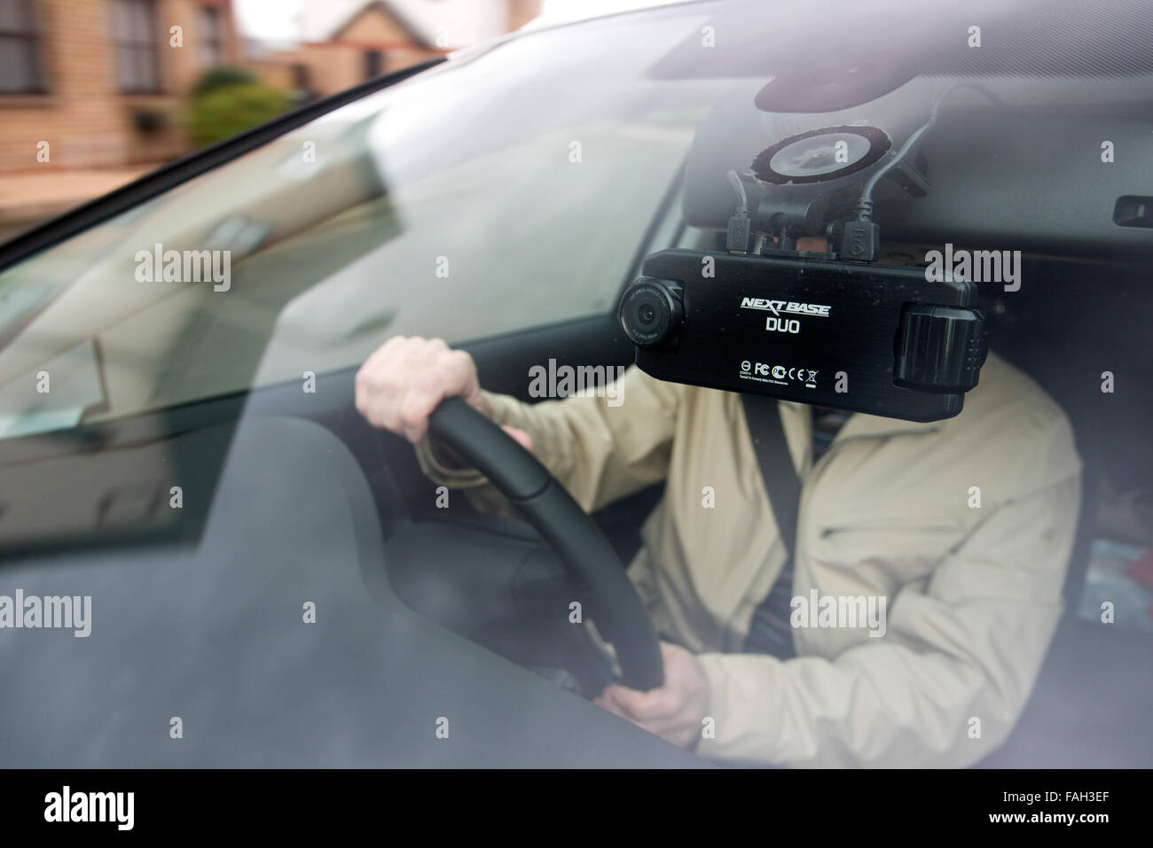 Driving a car with a dashcam video camera watching the road ahead Stock ...