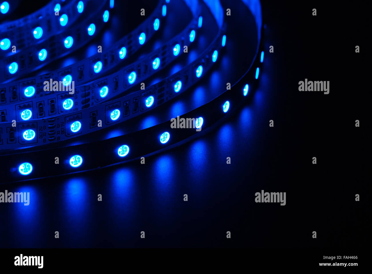 Blue led strip on the black background Stock Photo - Alamy