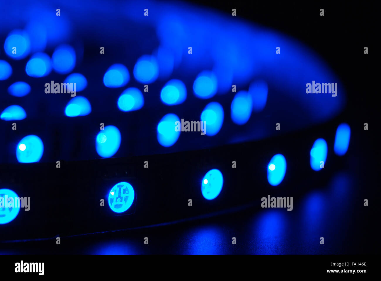 Blue led strip on the black background Stock Photo - Alamy