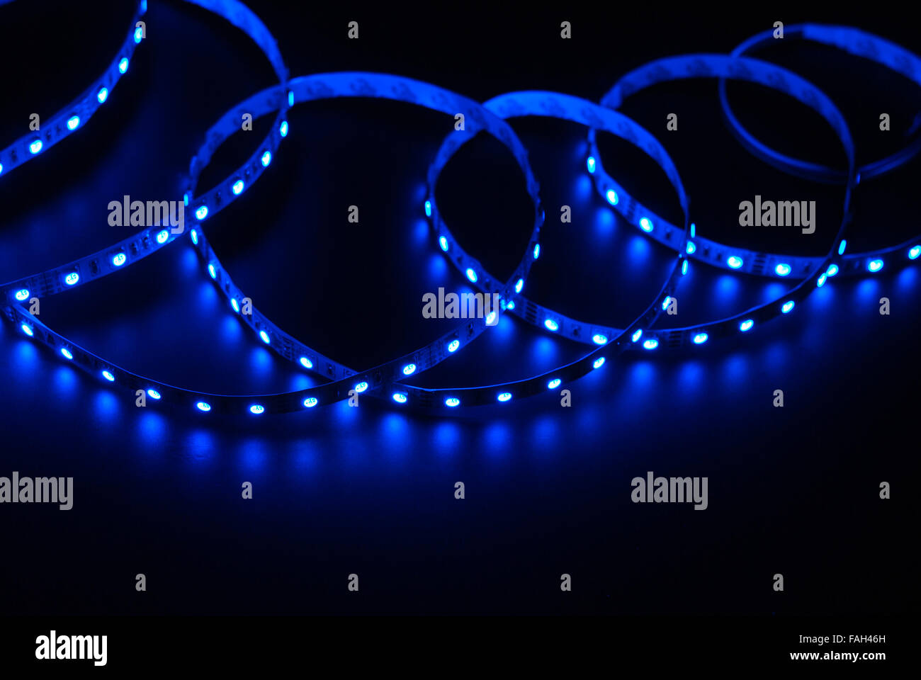 Blue led strip on the black background Stock Photo - Alamy