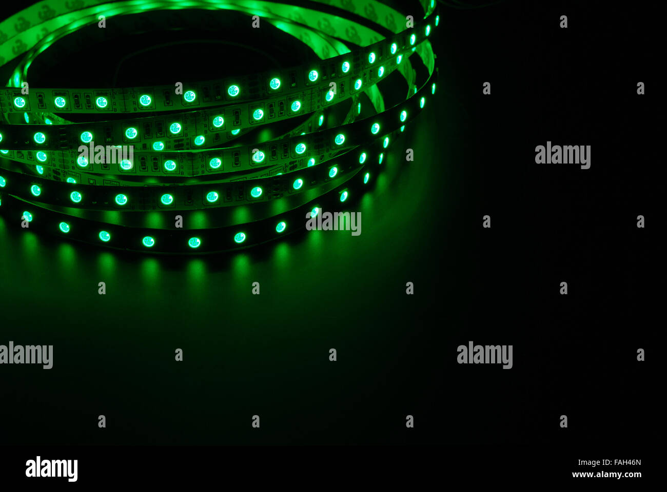 Green led strip on the black background Stock Photo - Alamy