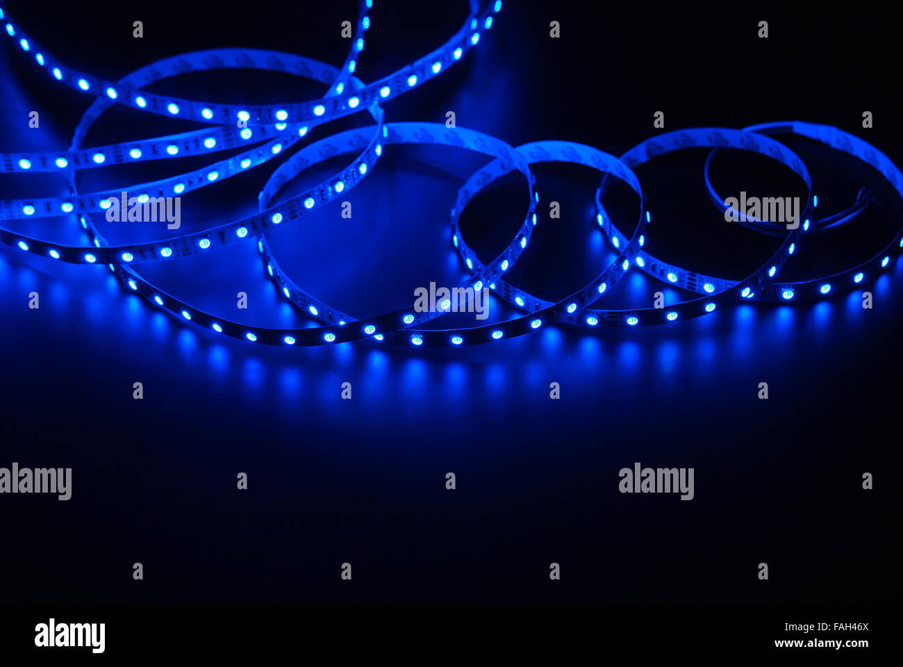 Blue led strip on the black background Stock Photo - Alamy