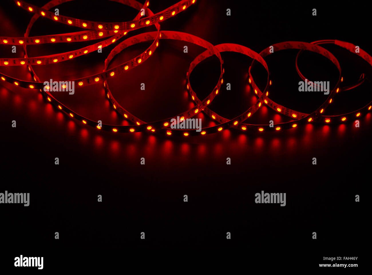 Red led strip on the black background Stock Photo - Alamy