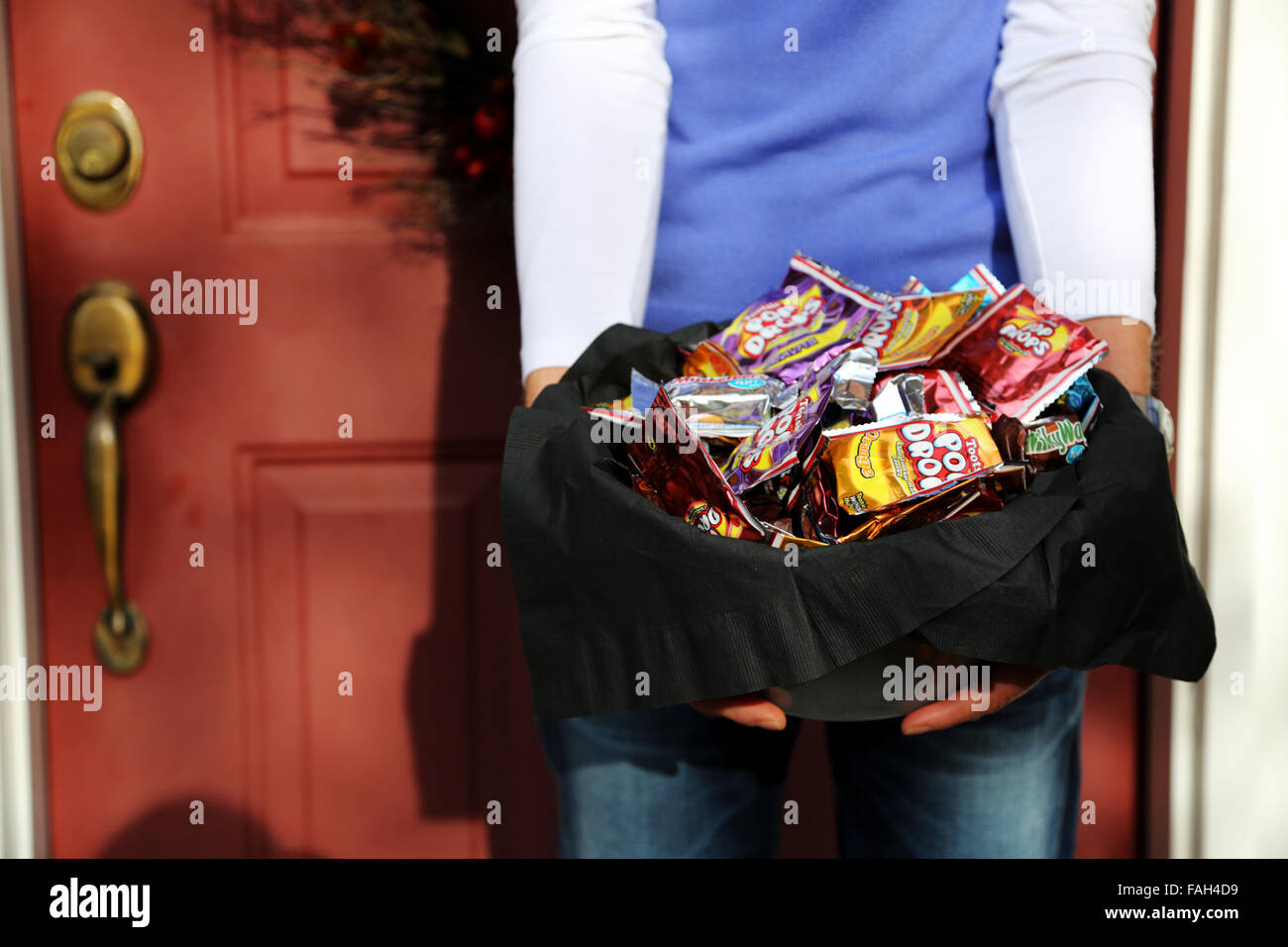 Children offering sweets hi-res stock photography and images - Alamy