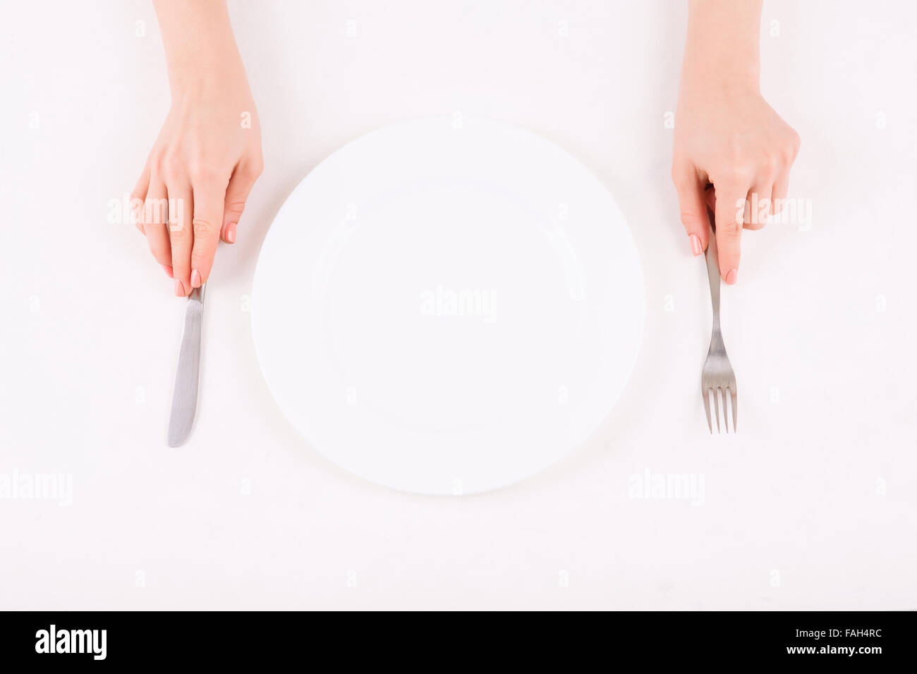 Female hands putting silverware on the table Stock Photo - Alamy
