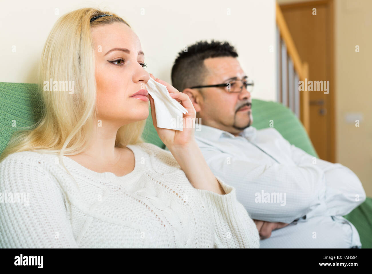 Sad married couple having problems at home Stock Photo - Alamy