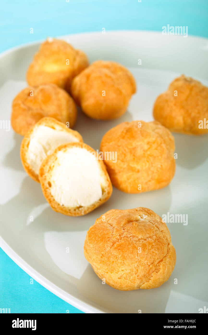 Cream filled puff pastry profiteroles hi-res stock photography and ...