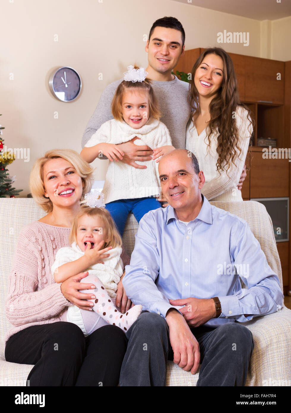 Big united family members laughing together in living room Stock Photo ...