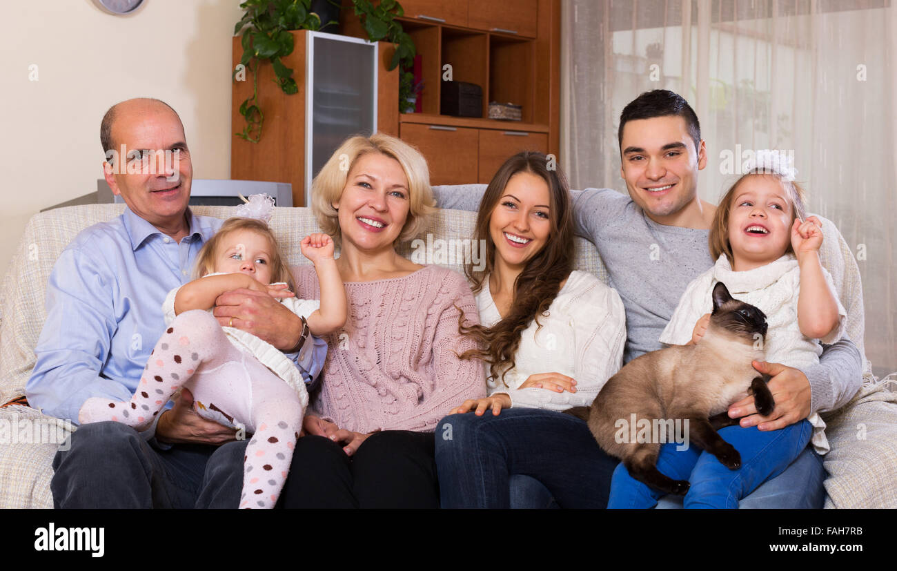 Long family with grand children posing indoors Stock Photo - Alamy