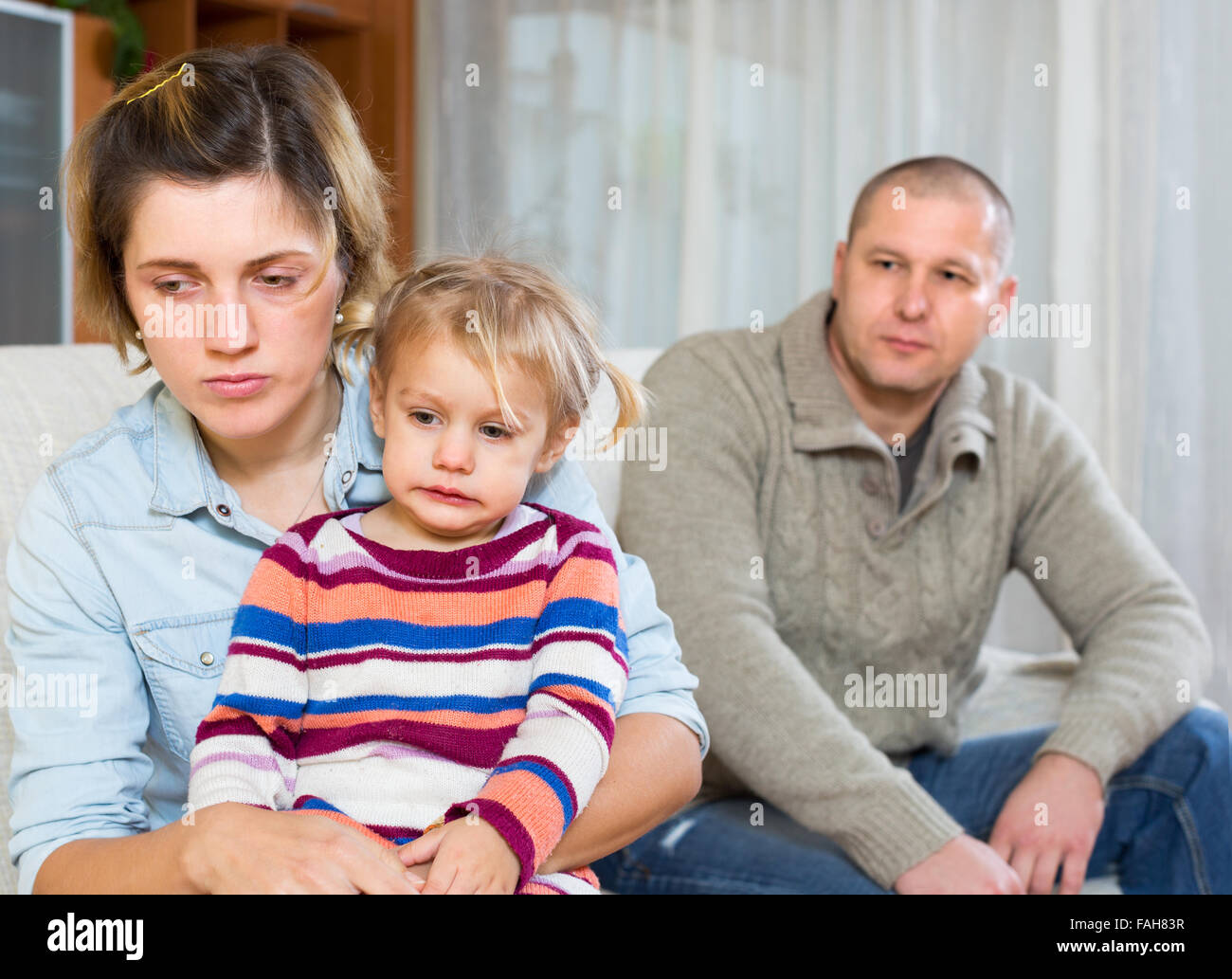 Family with little child having conflict at home Stock Photo - Alamy
