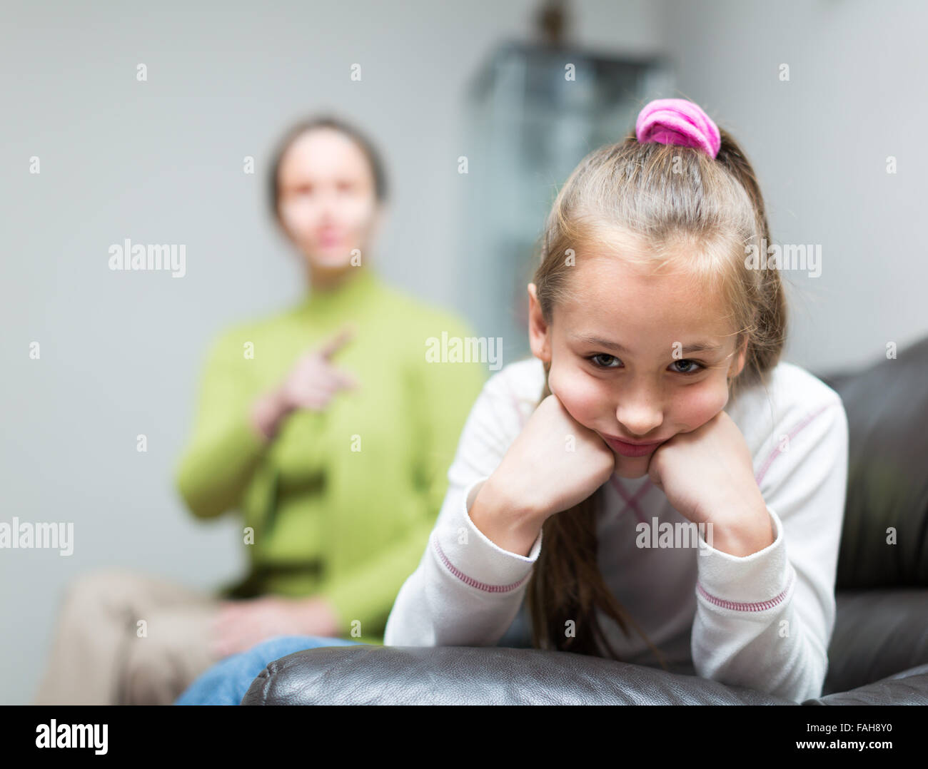Mother berating daughter at interior Stock Photo - Alamy