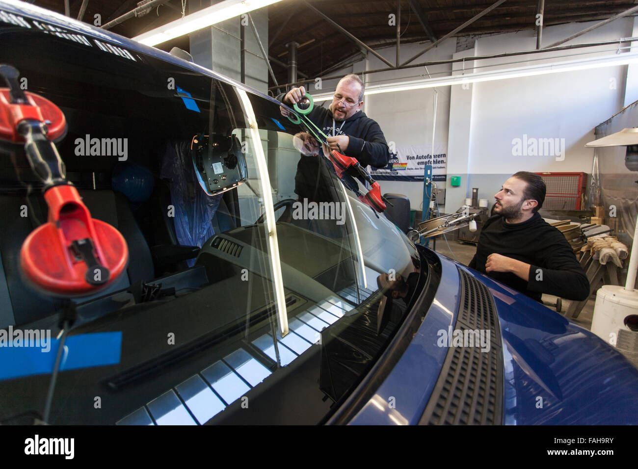 Replace the windscreen in an auto glass workshop Stock Photo - Alamy