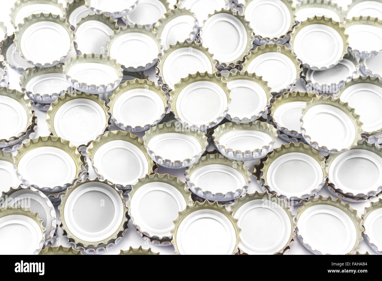 Bottle caps on white background Stock Photo - Alamy