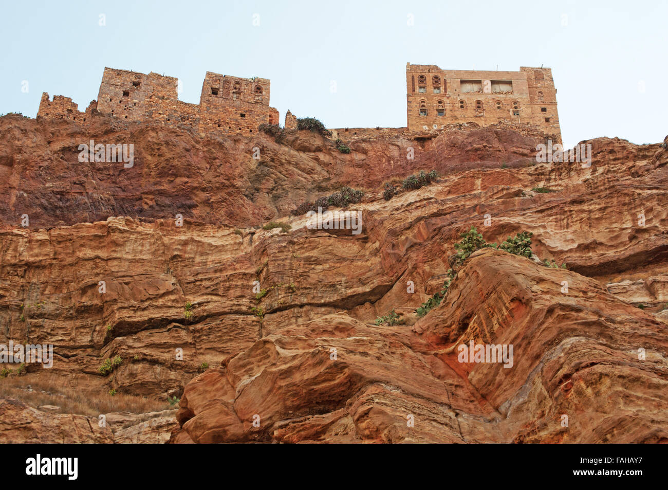 Yemen: red rocks and decorated old houses built on the top of a ...
