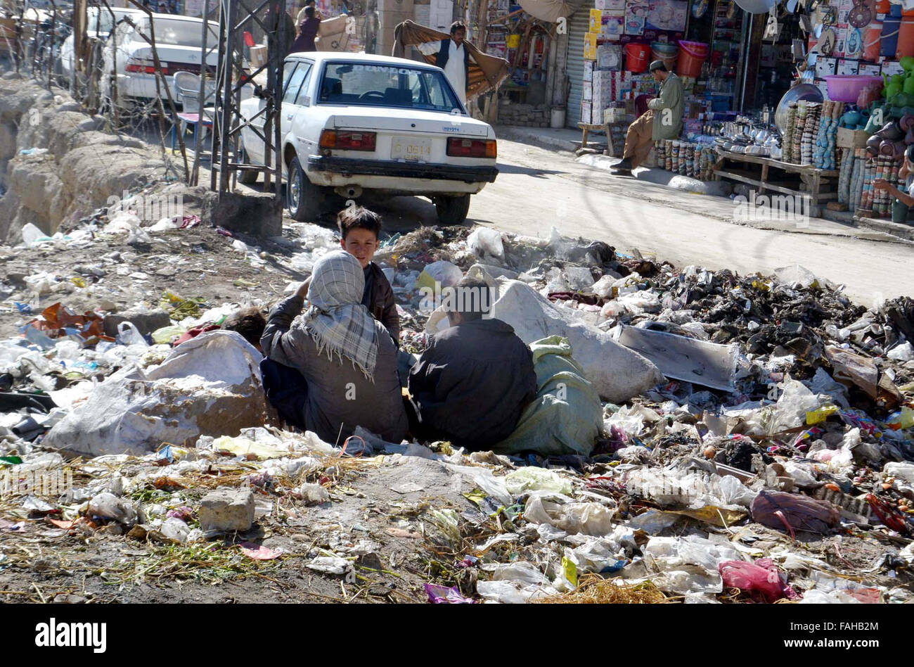 Garbage collectors children searching for any useful thing on a heap of ...