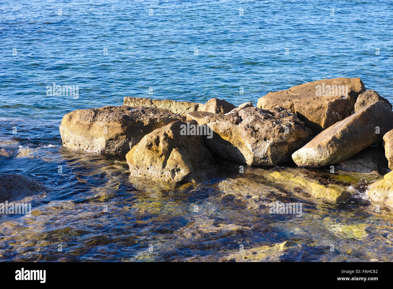Stones in sea Stock Photo - Alamy