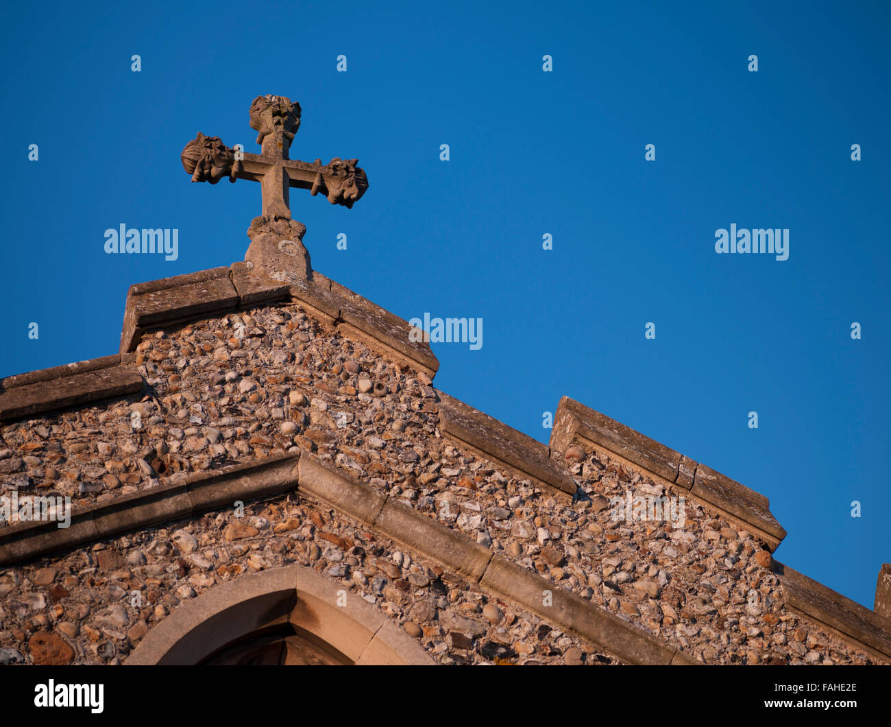 Cross above a church entrance Stock Photo - Alamy
