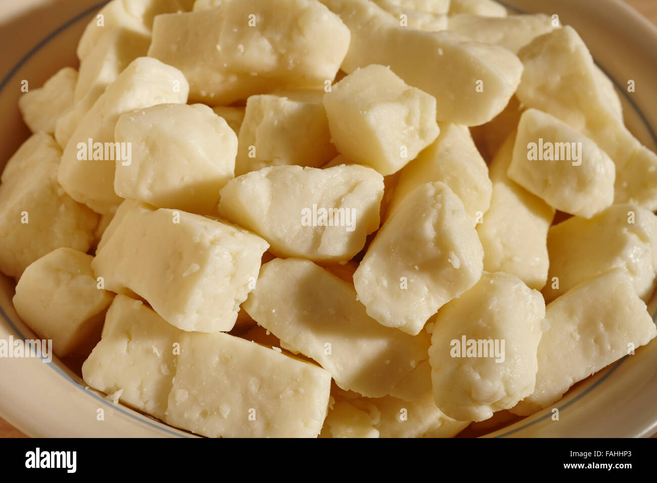 Fresh cheddar cheese curds, a popular snack in many parts of the United ...