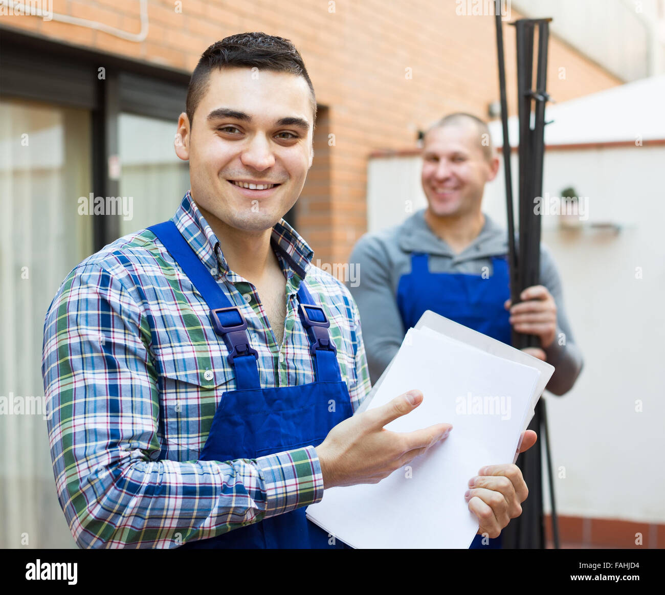 Portrait of two happy professional workers in uniform Stock Photo - Alamy