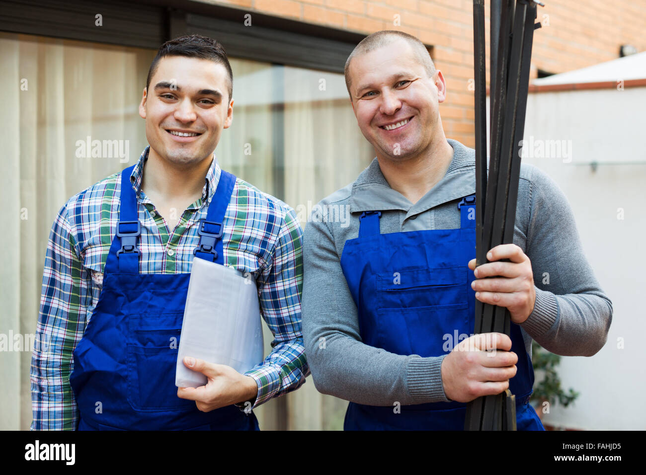 Positive factory workers at the workplace Stock Photo - Alamy
