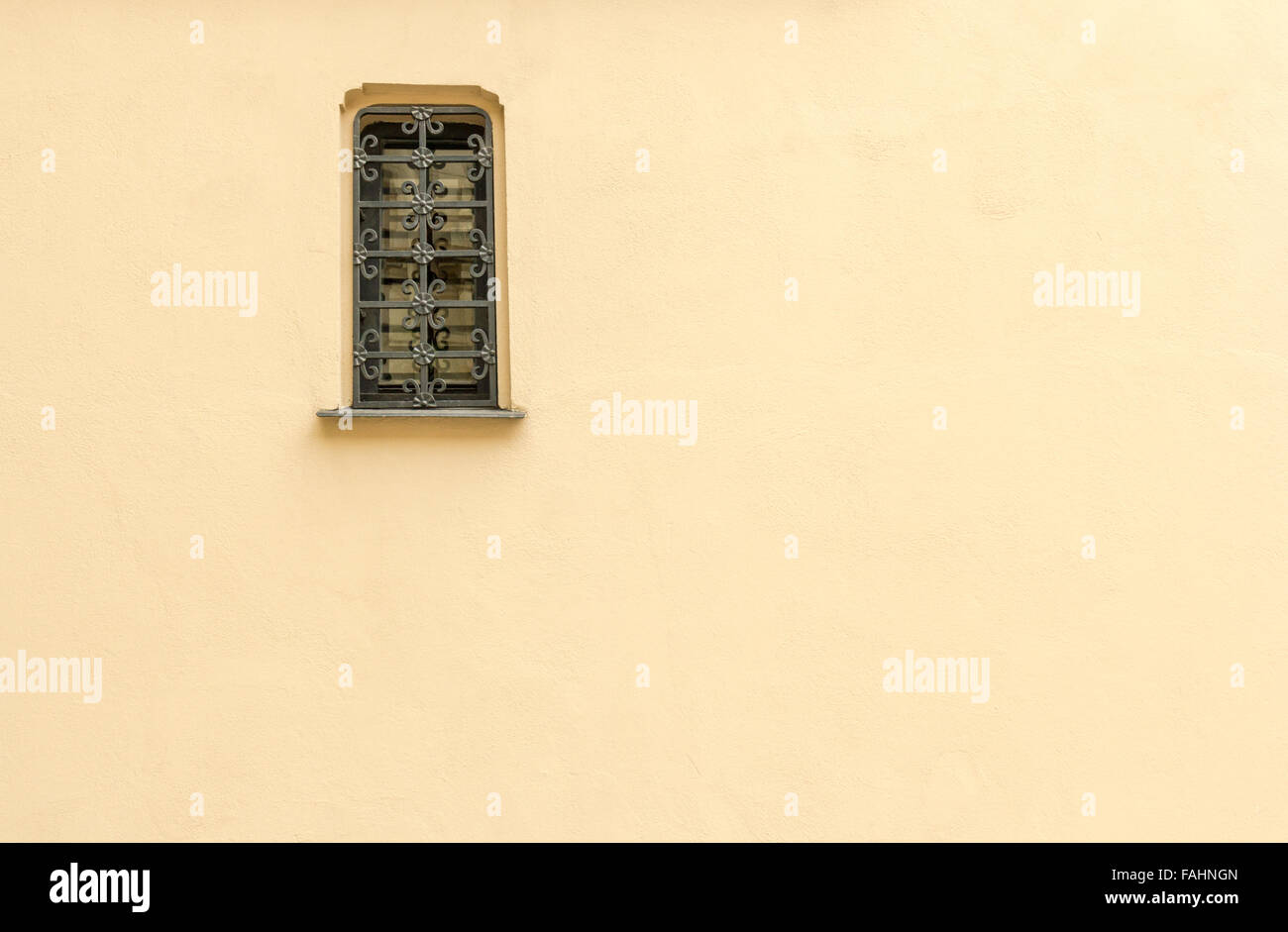 Latticed window with beige background Stock Photo - Alamy