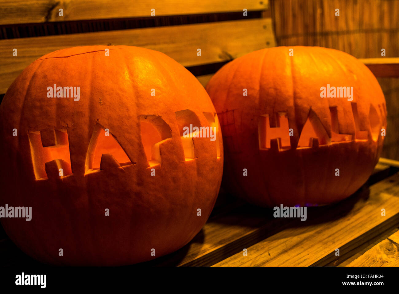 Carved pumpkins lit up at night for Halloween Stock Photo - Alamy
