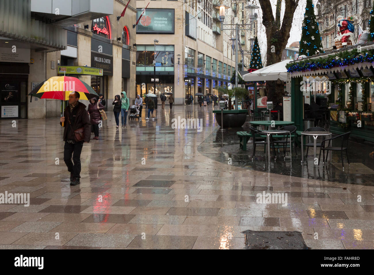 People walking in the rain along the streets of Cardiff Stock Photo - Alamy