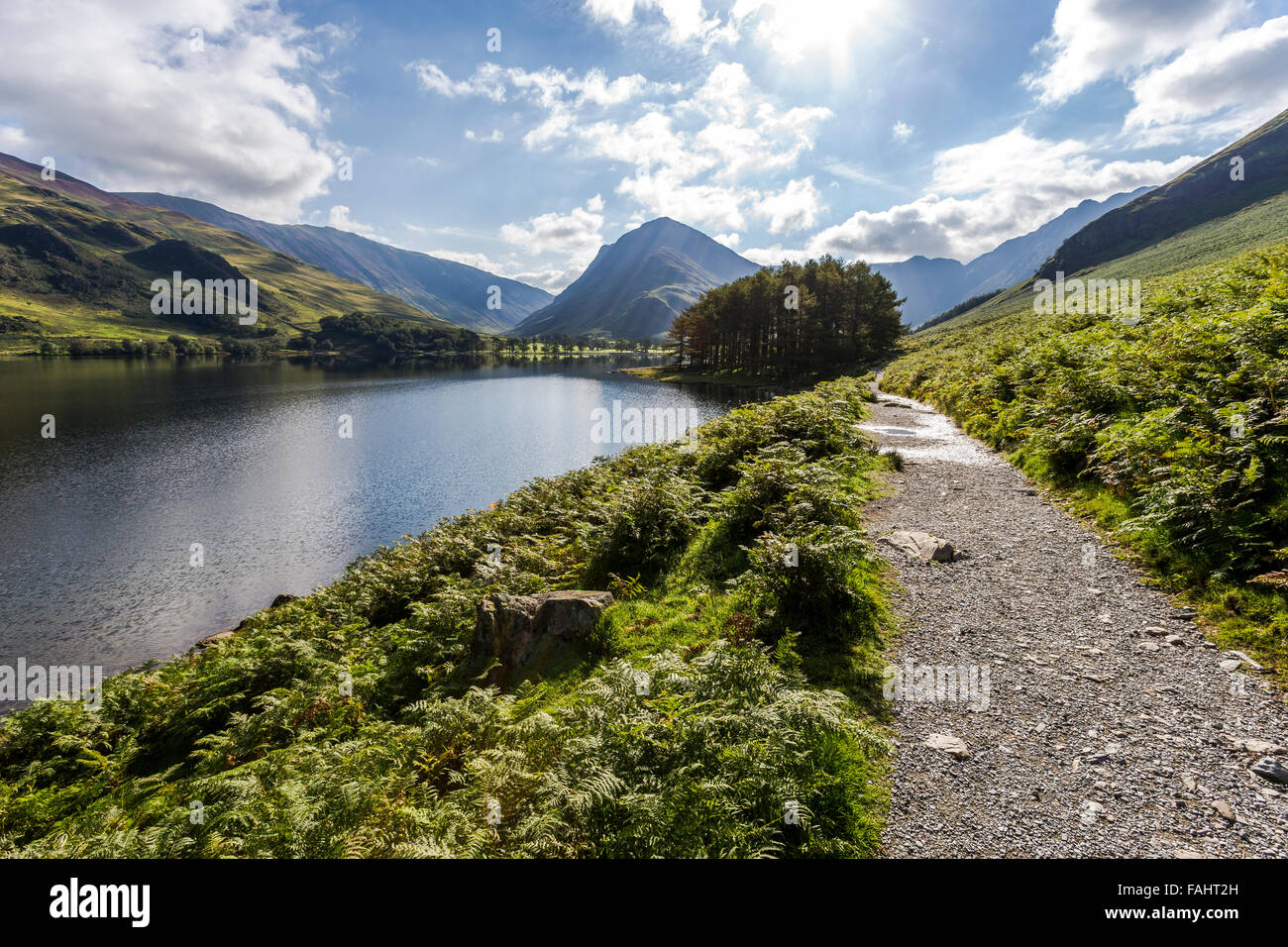 Lake Buttermere reflecting the surrounding hills on a bright sunny ...