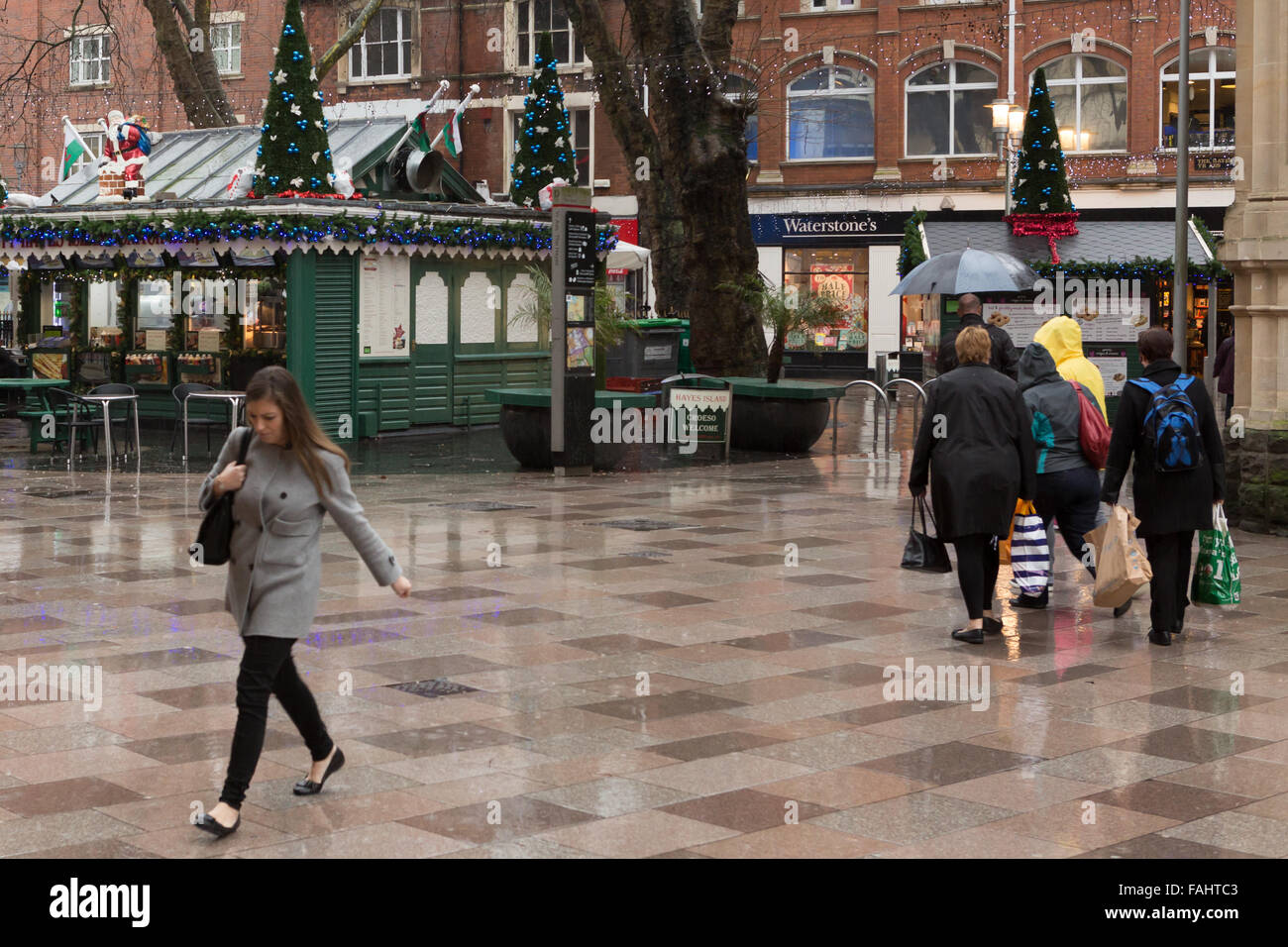 People walking in the rain along the streets of Cardiff Stock Photo - Alamy