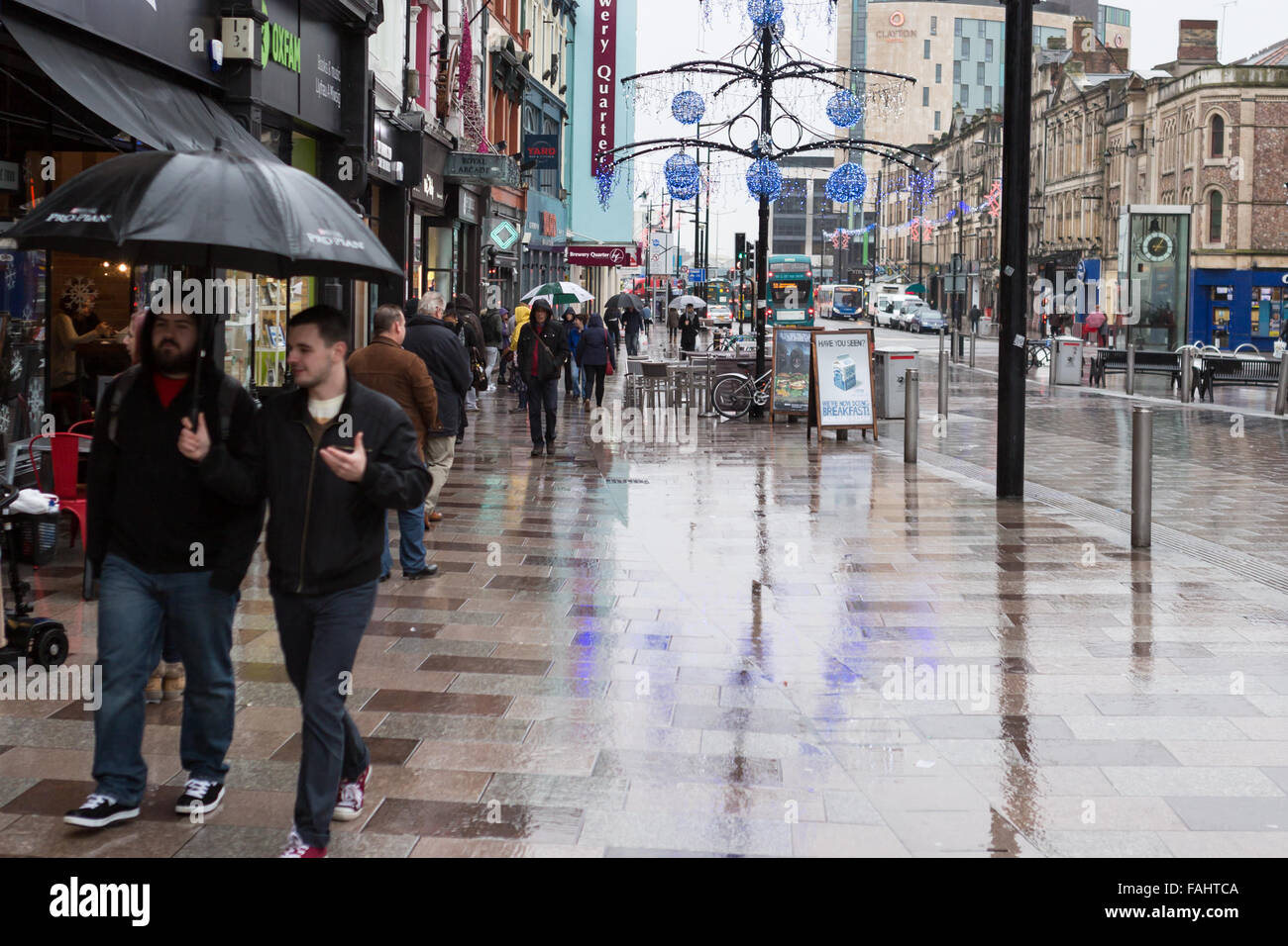 People walking in the rain along the streets of Cardiff Stock Photo - Alamy