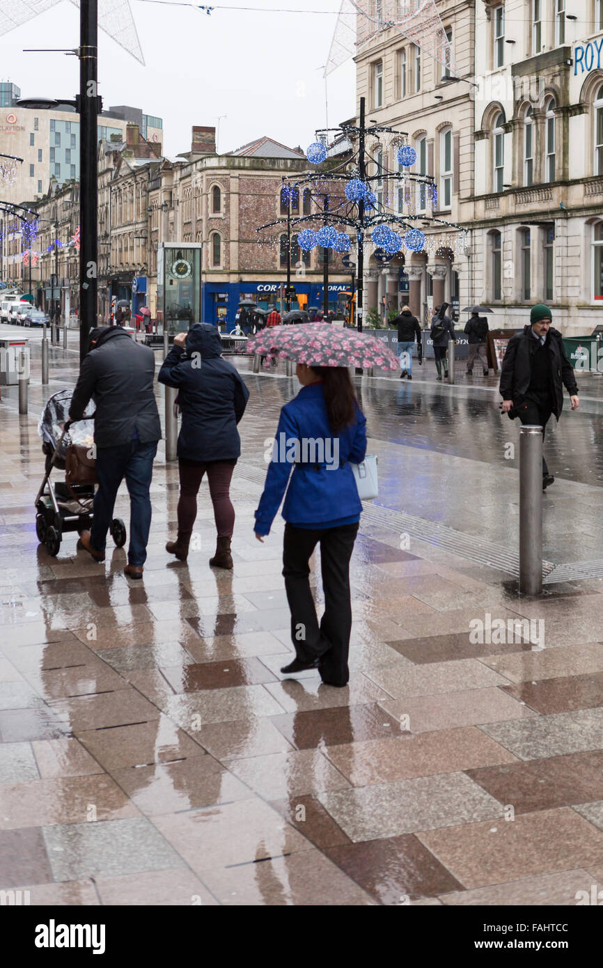 People walking in the rain along the streets of Cardiff Stock Photo - Alamy