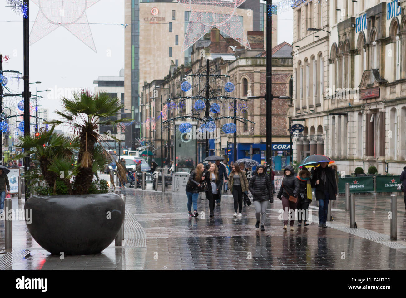 People walking in the rain along the streets of Cardiff Stock Photo - Alamy