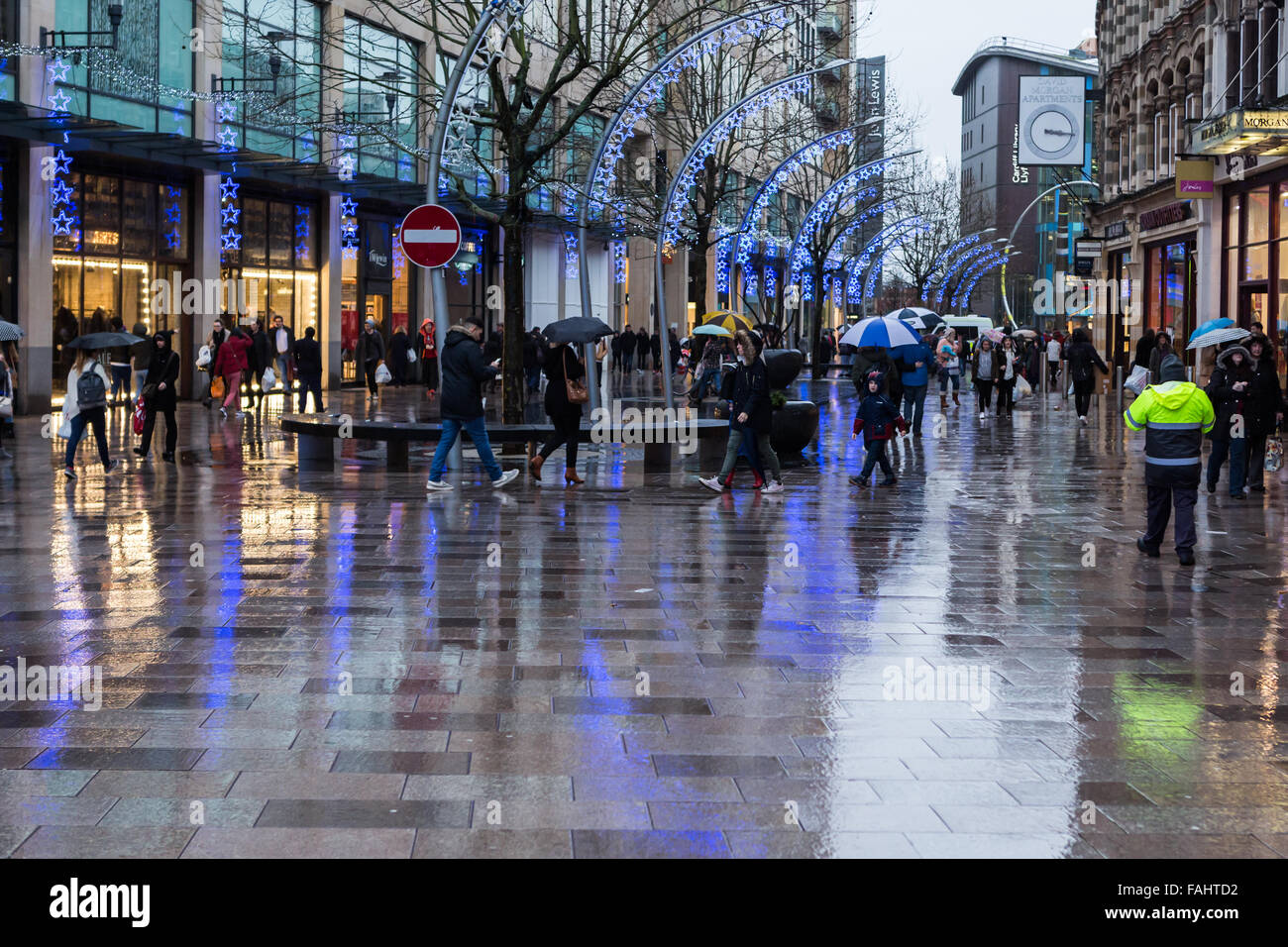 People walking in the rain along the streets of Cardiff Stock Photo - Alamy