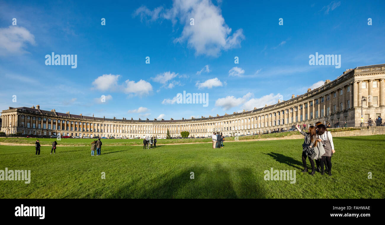 Groups of mainly Asian people pose for selfies and photographs on the ...