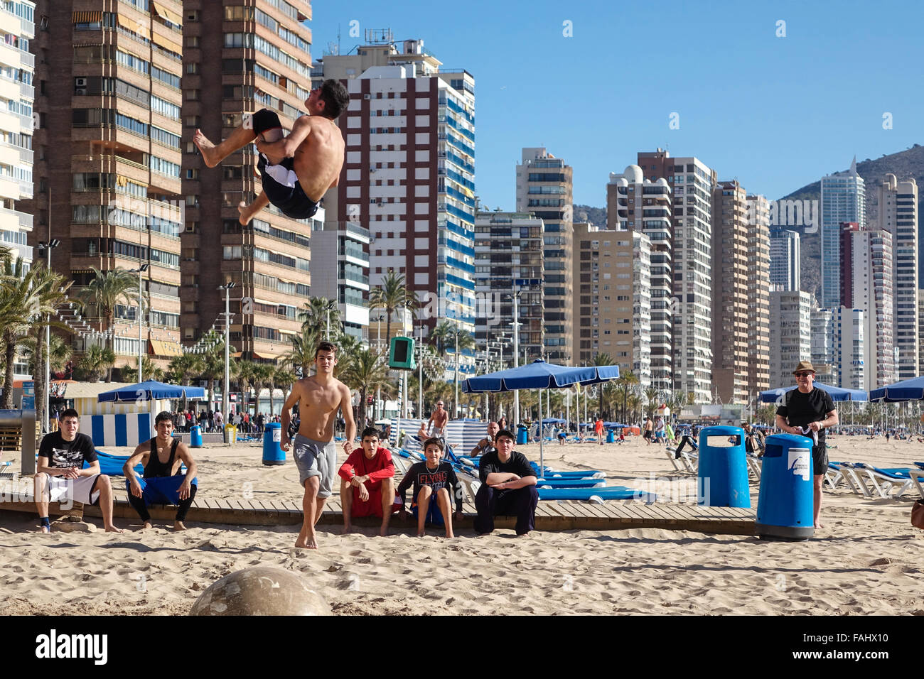 Young men practice tumbling, acrobatics, spinning and jumping on the ...