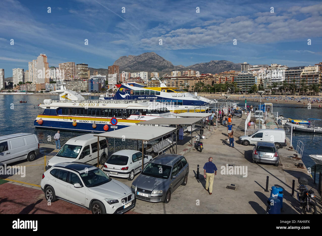 Tourists queue for the boats in Benidorm harbour Alicante Province ...