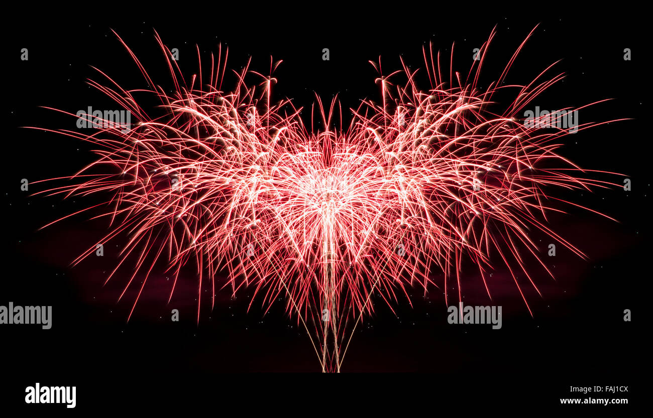 Red fireworks combination on the dark sky Stock Photo - Alamy