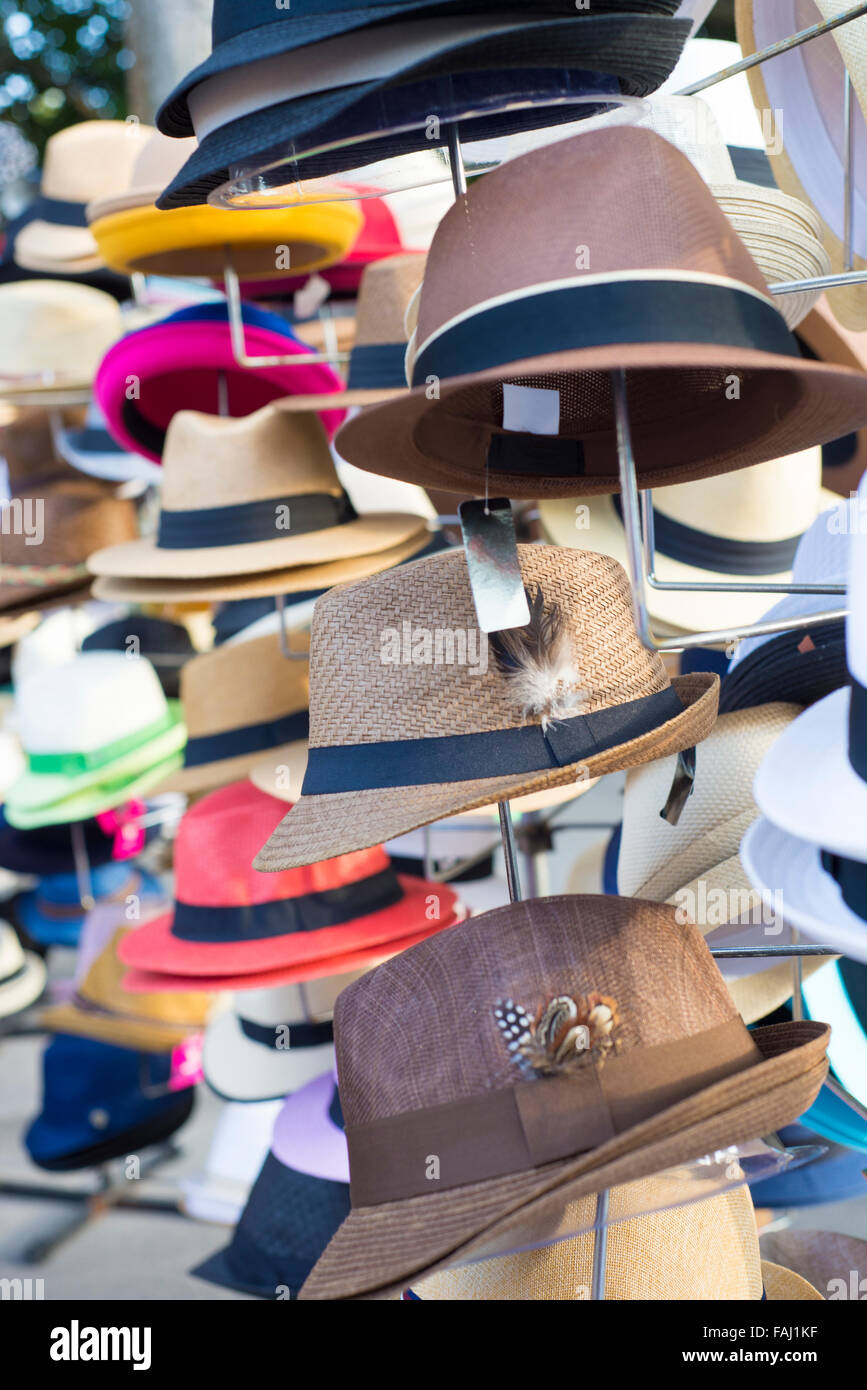Several assorted hats on display at street festival Stock Photo - Alamy