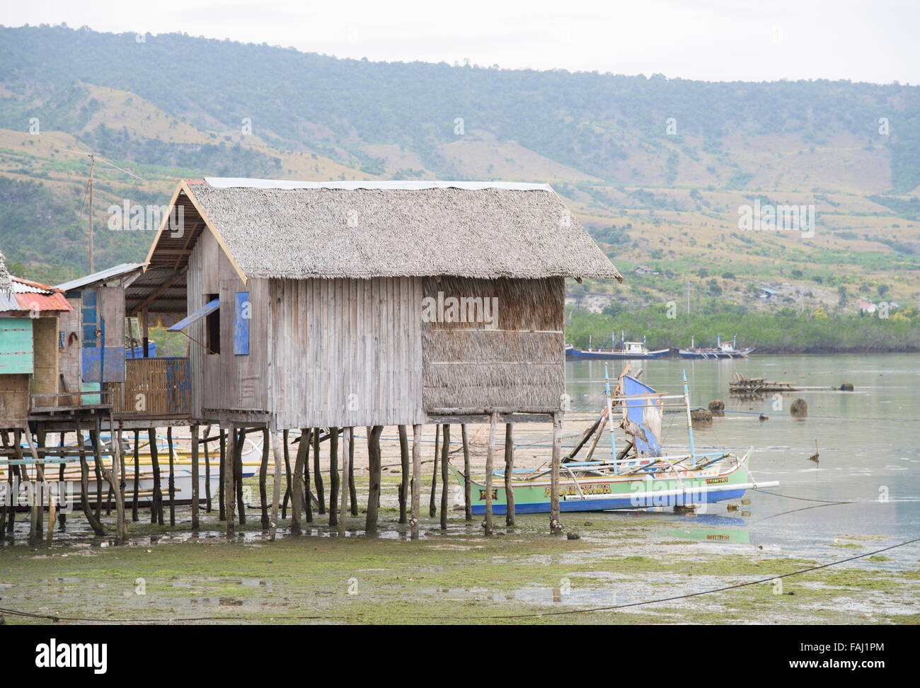 Fisherman’s cottage on stilts at low tide in the village of Tinito ...