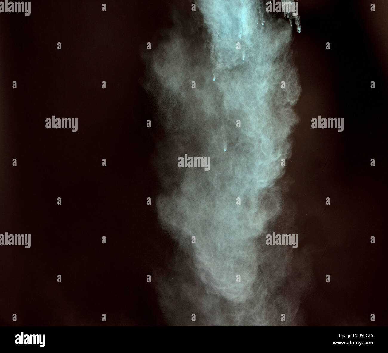 Enticing and gorgeous powder of colors being spread in air at night ...