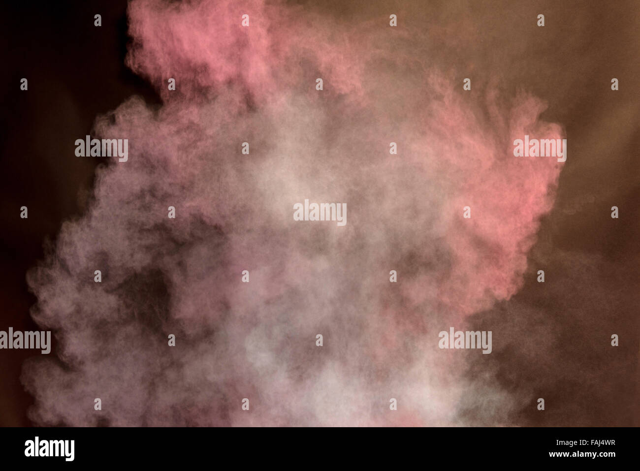 Enticing and gorgeous powder of colors being spread in air at night ...