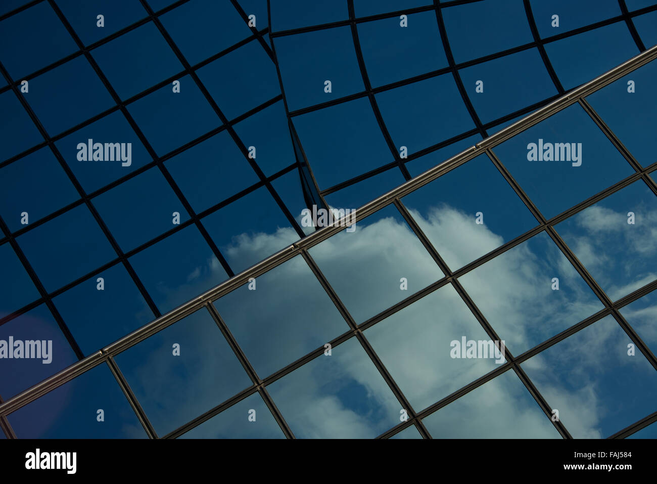 Blue sky and cloud reflected in windows Stock Photo - Alamy