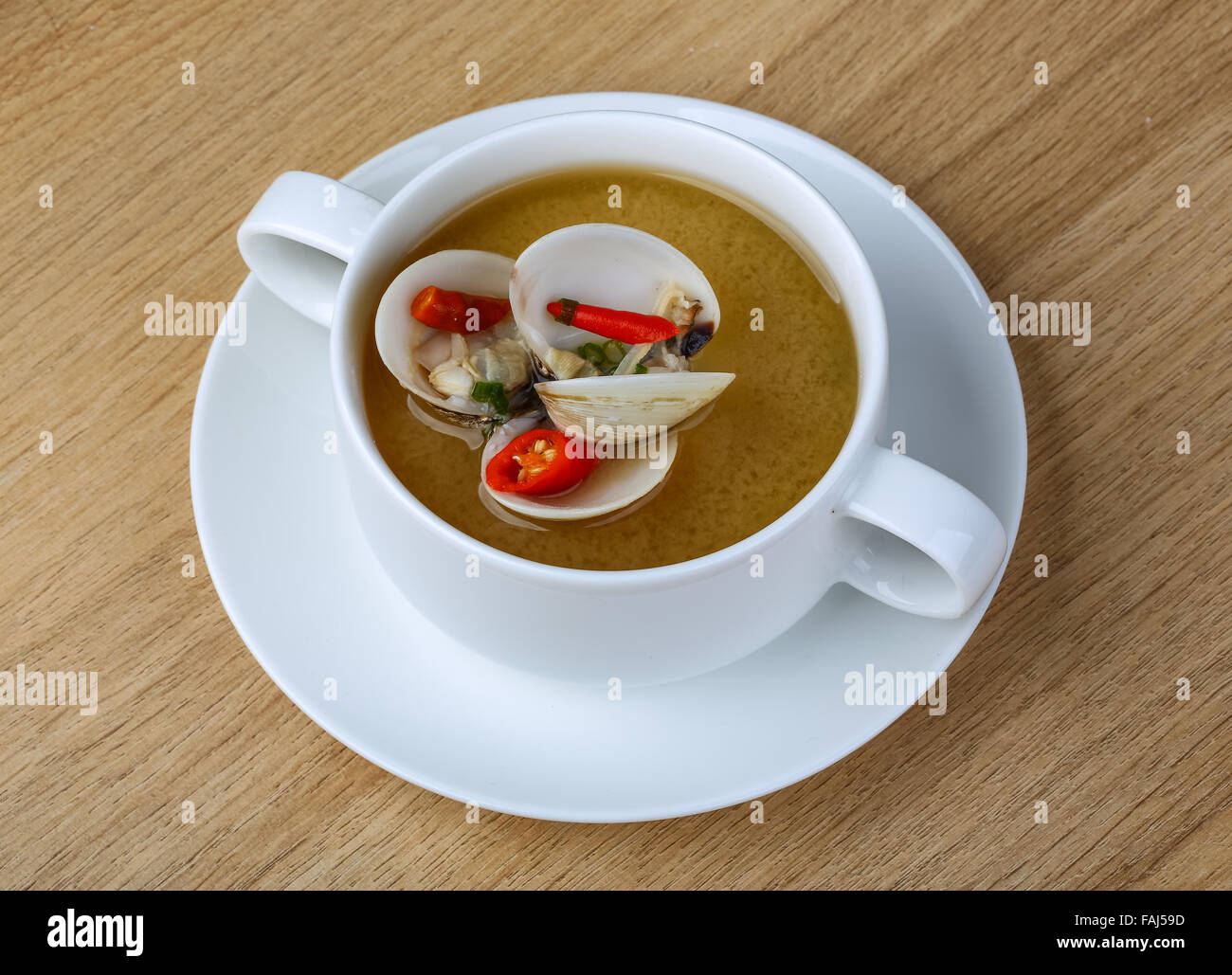 Asian traditional Shell soup on the wood background Stock Photo - Alamy