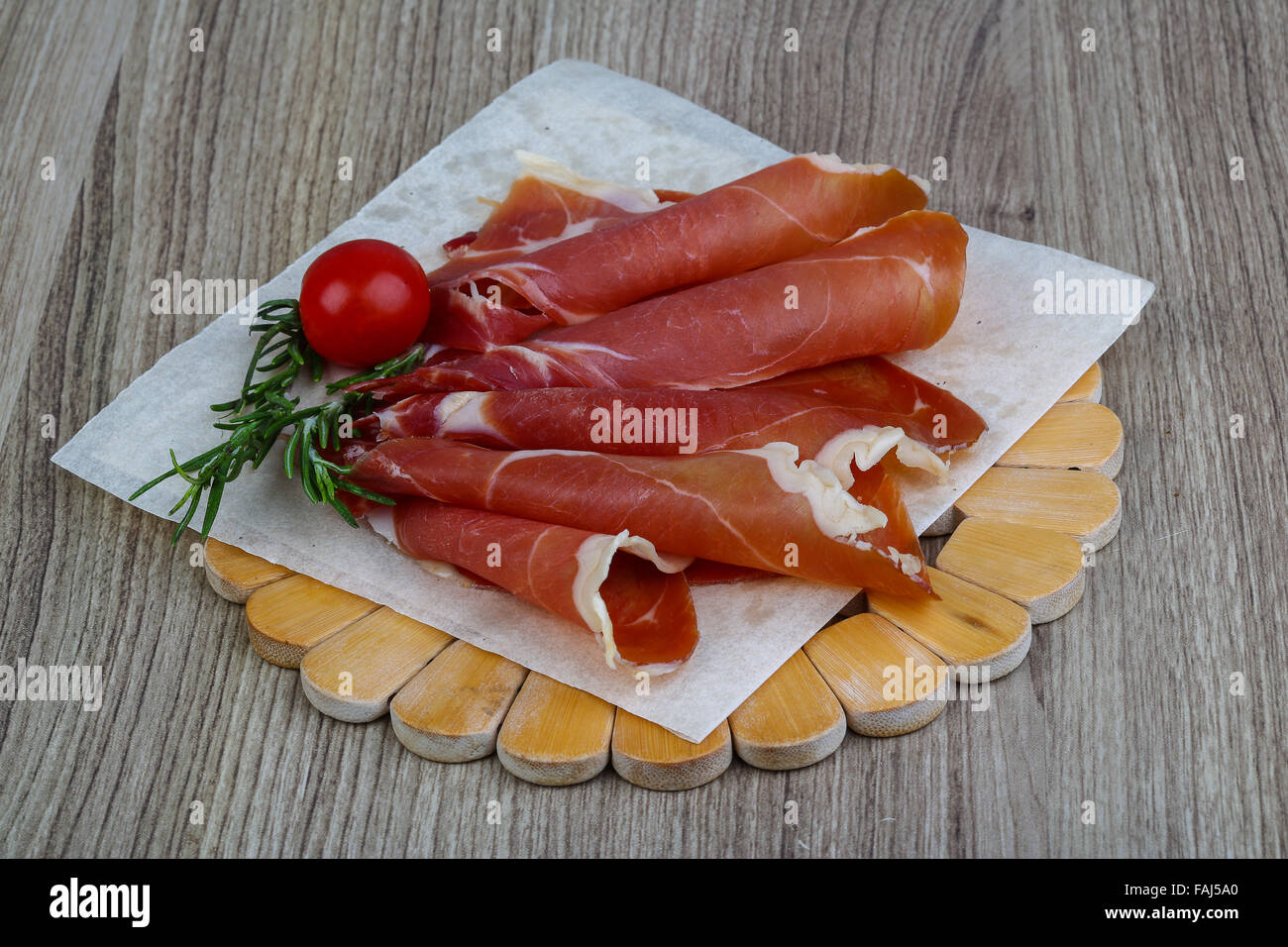 Spanish traditional snack - Jamon with tomato and rosemary Stock Photo ...