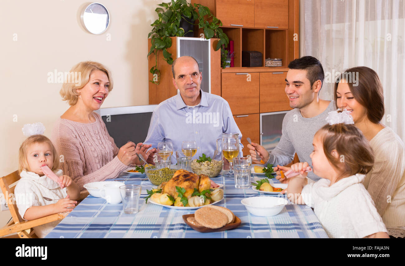 Multigenerational family sitting table hi-res stock photography and ...