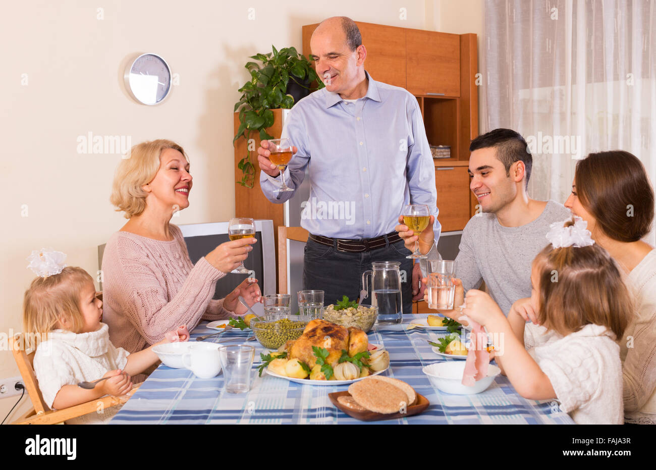 Multigenerational family sitting table hi-res stock photography and ...