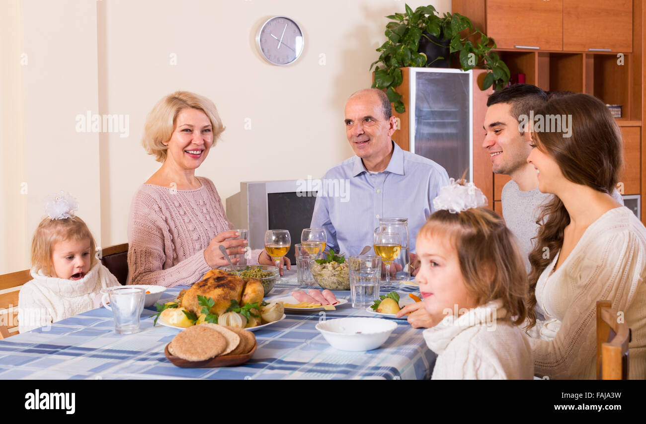 Multigenerational family sitting table hi-res stock photography and ...