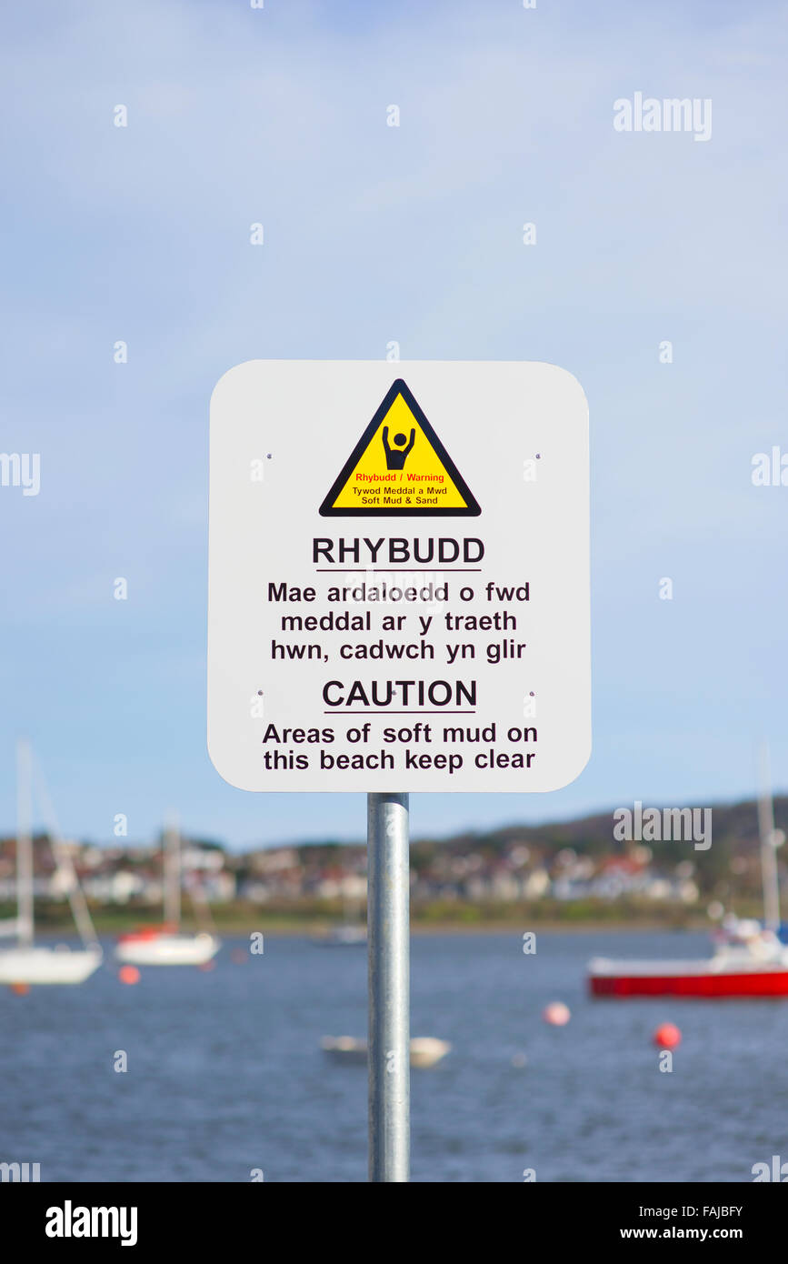 Caution soft mud warning sign at Conway harbour in Welsh and English ...